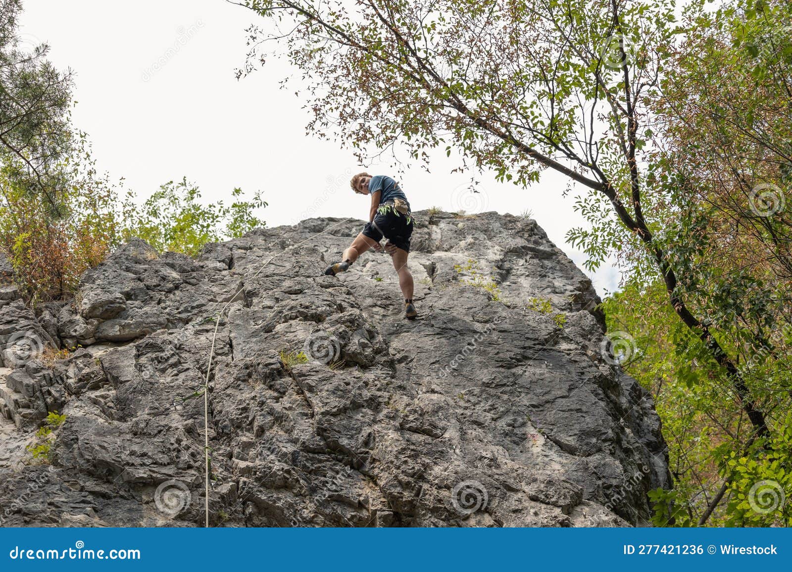 Brave Climber is Descending from a Rocky Cliff Stock Photo - Image of ...