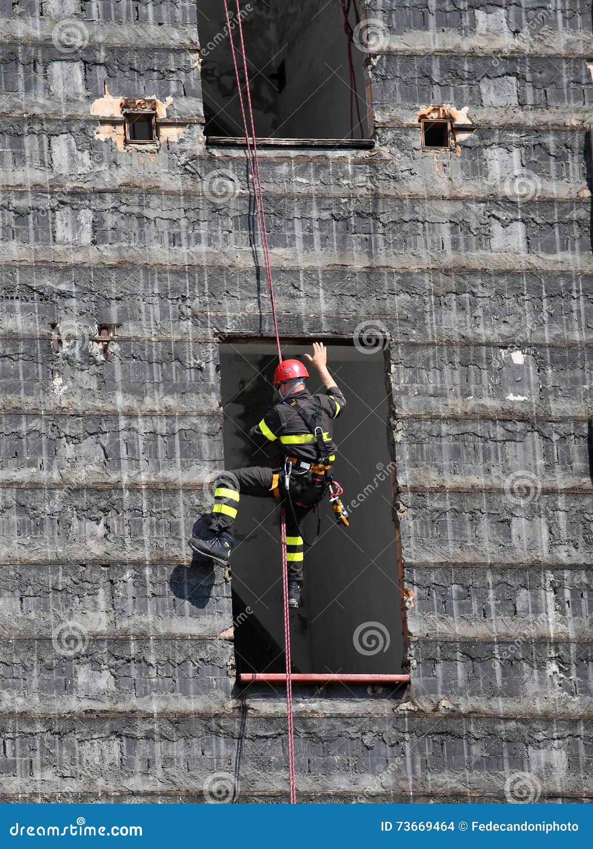 Brave Climber of Firefighters Rappelling the Wall Stock Photo - Image ...