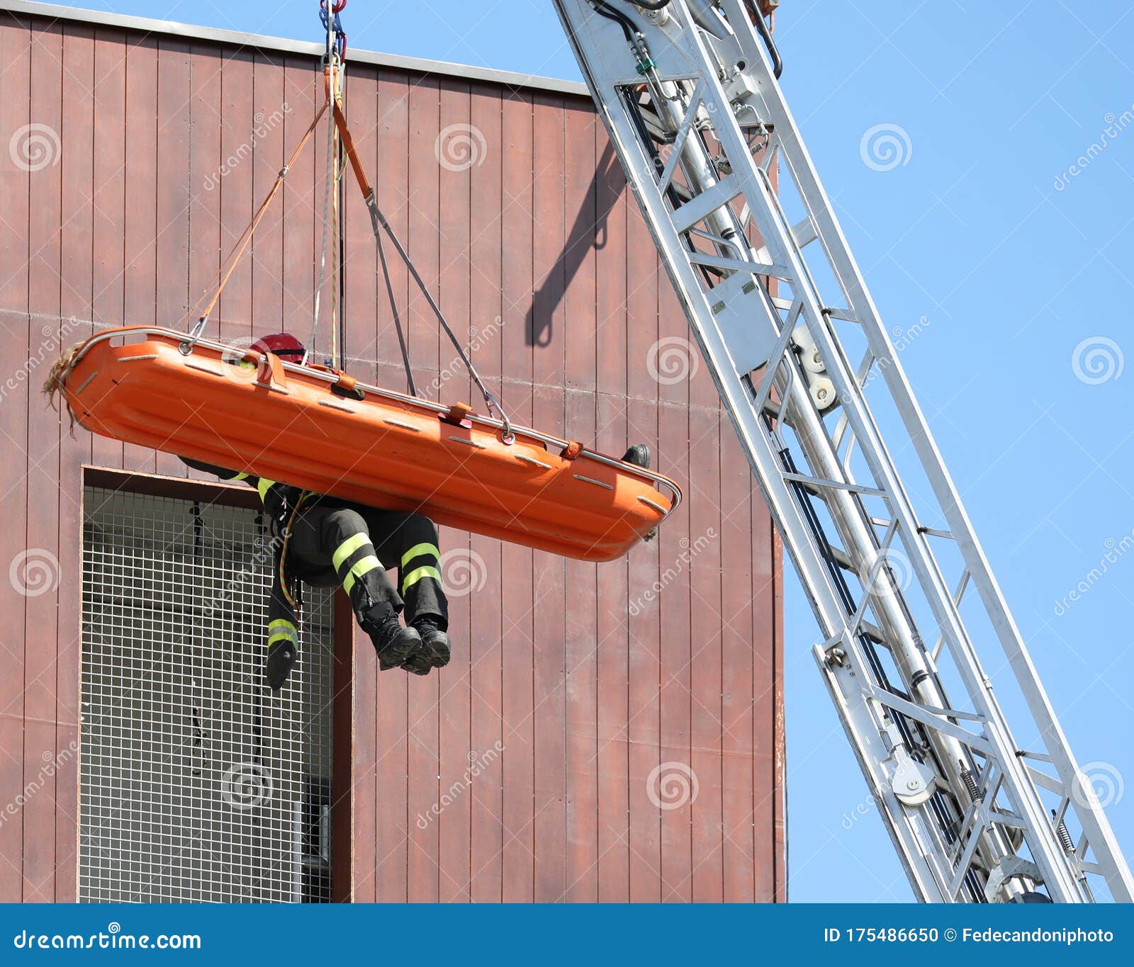 Brave Firefighter on the Stretcher with Person Stock Photo - Image of ...