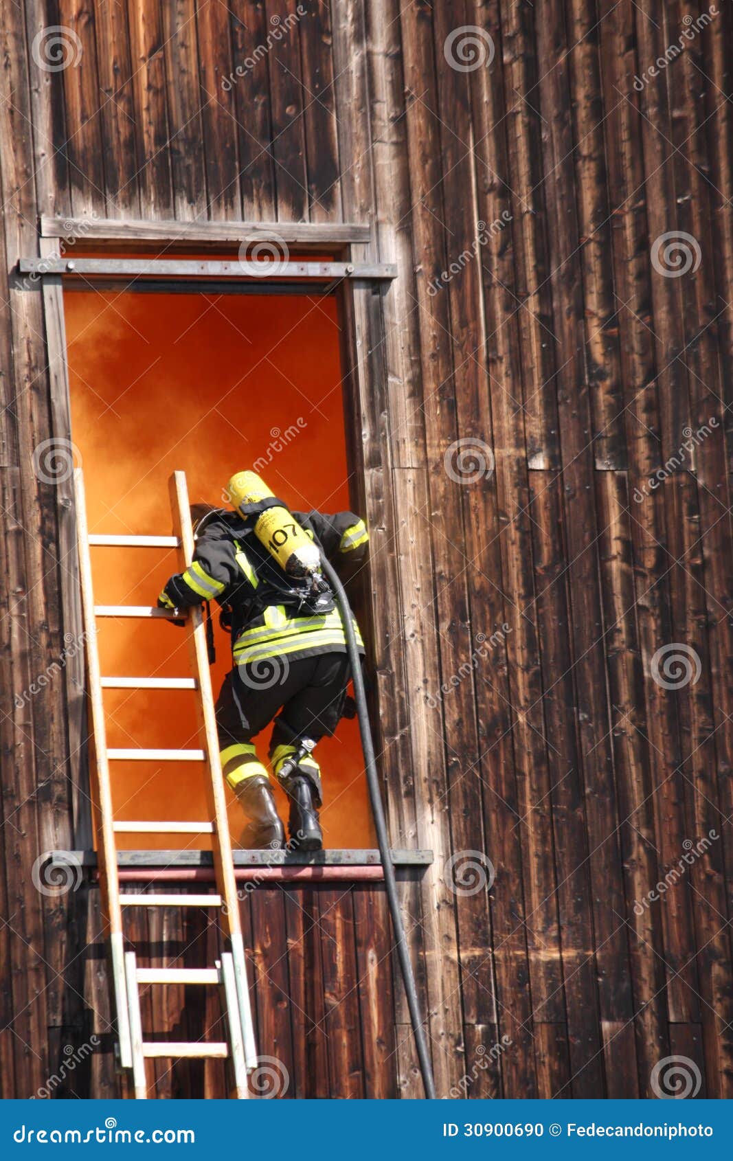 Brave Firefighters Battling An Intense Building Fire At Night Royalty ...