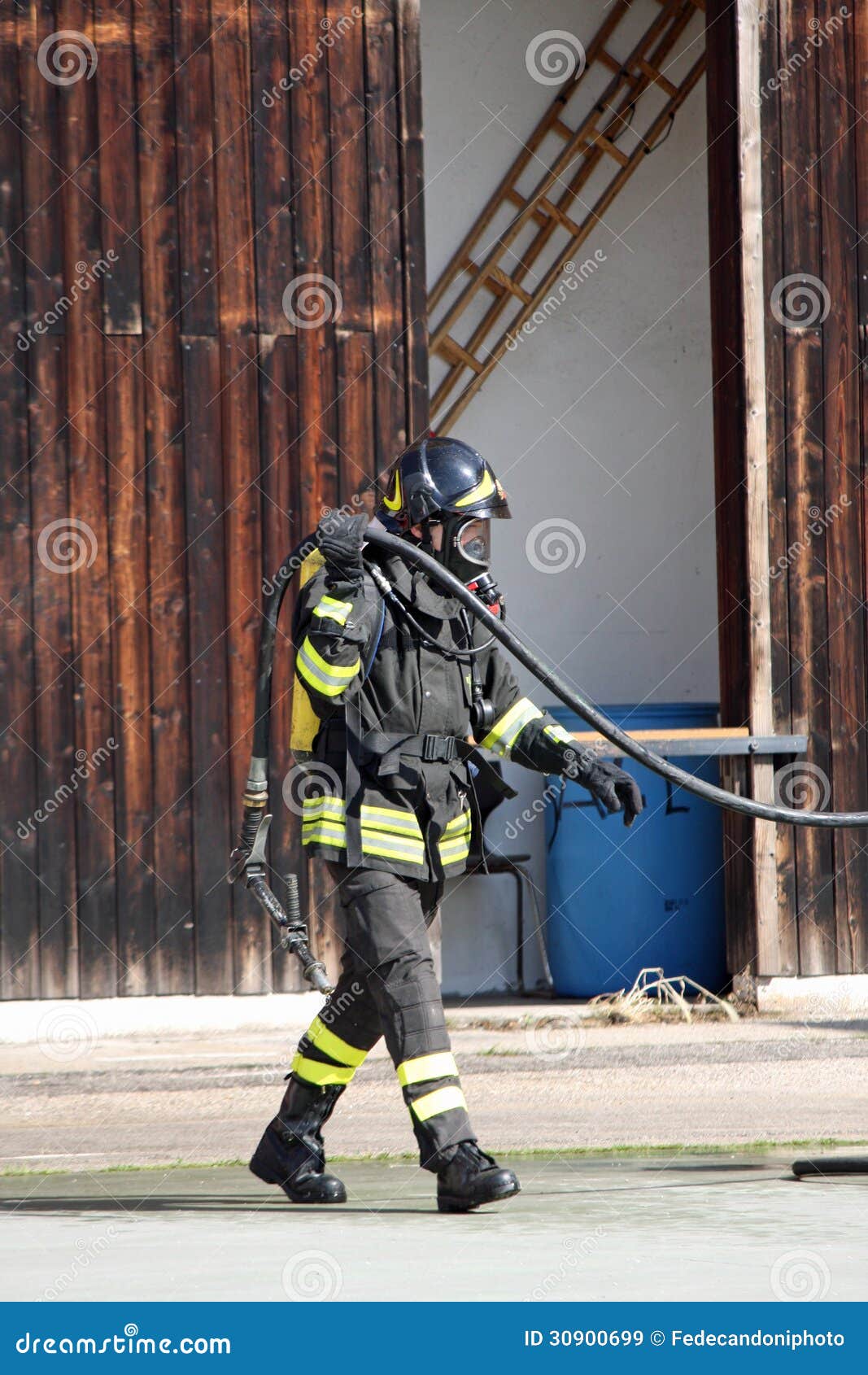 Brave Firefighters with Oxygen Tank Fire during an Exercise Held ...