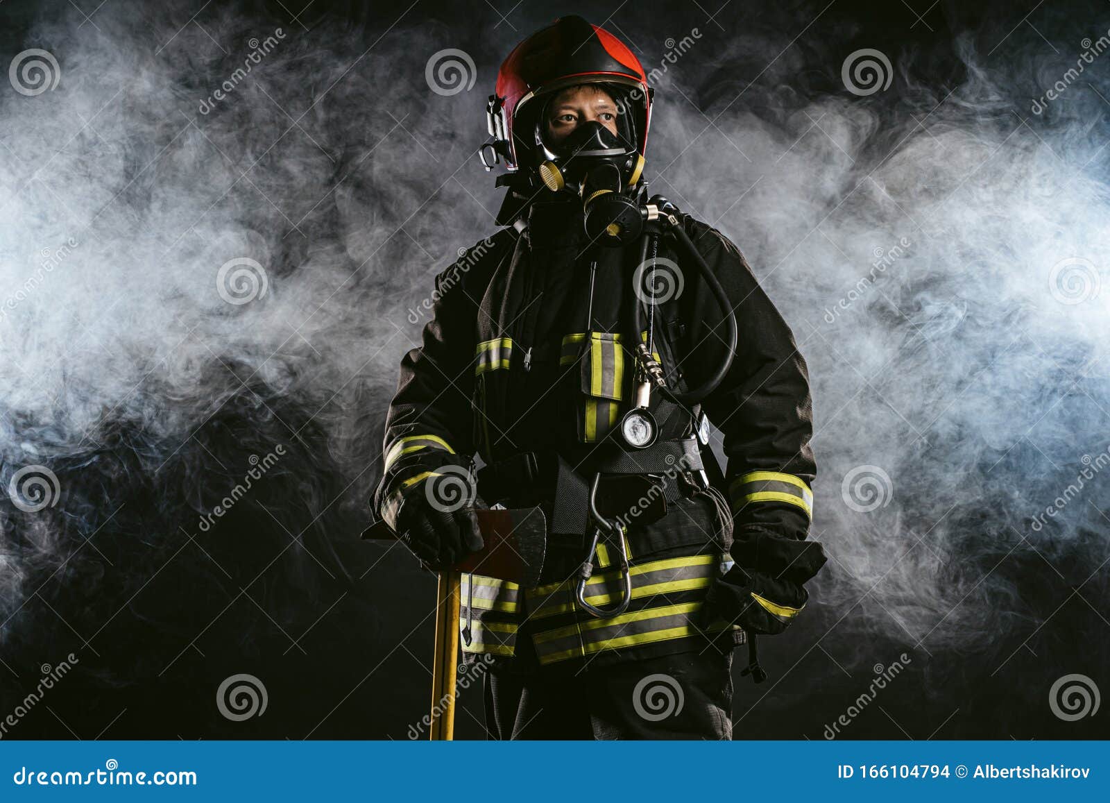 Brave fireman in uniform stock photo. Image of costume - 166104794