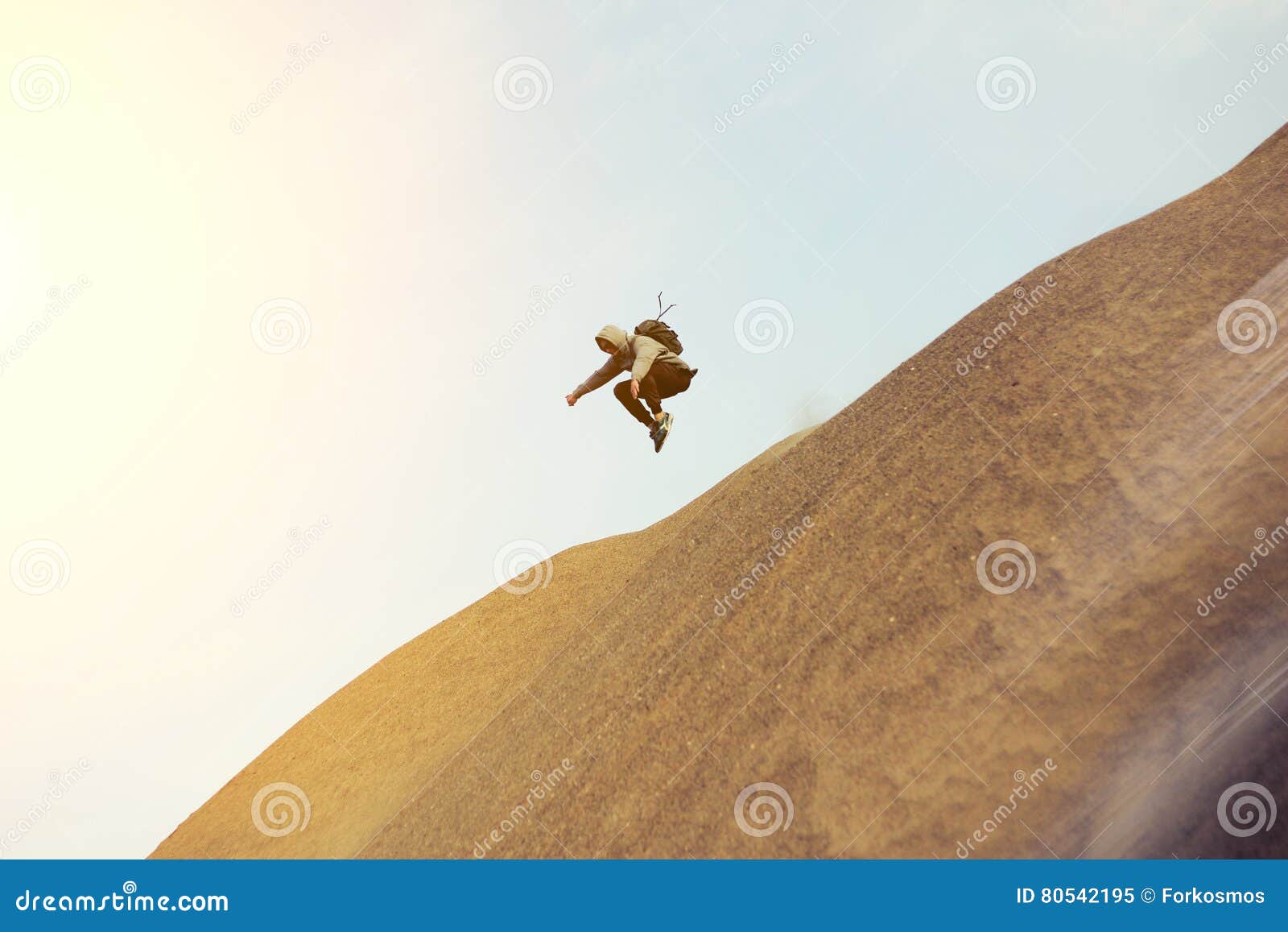 Brave Man with Backpack Running and Jumping on a Dune Stock Image ...