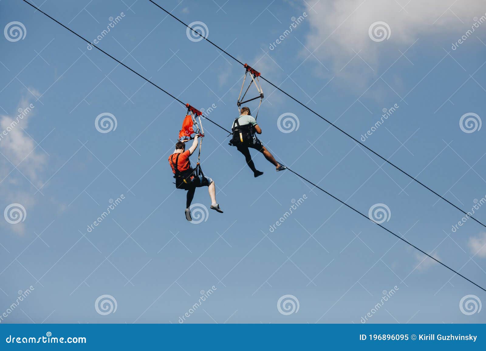 A Brave Man Descends on a Zip Line High in the Mountains Above the ...
