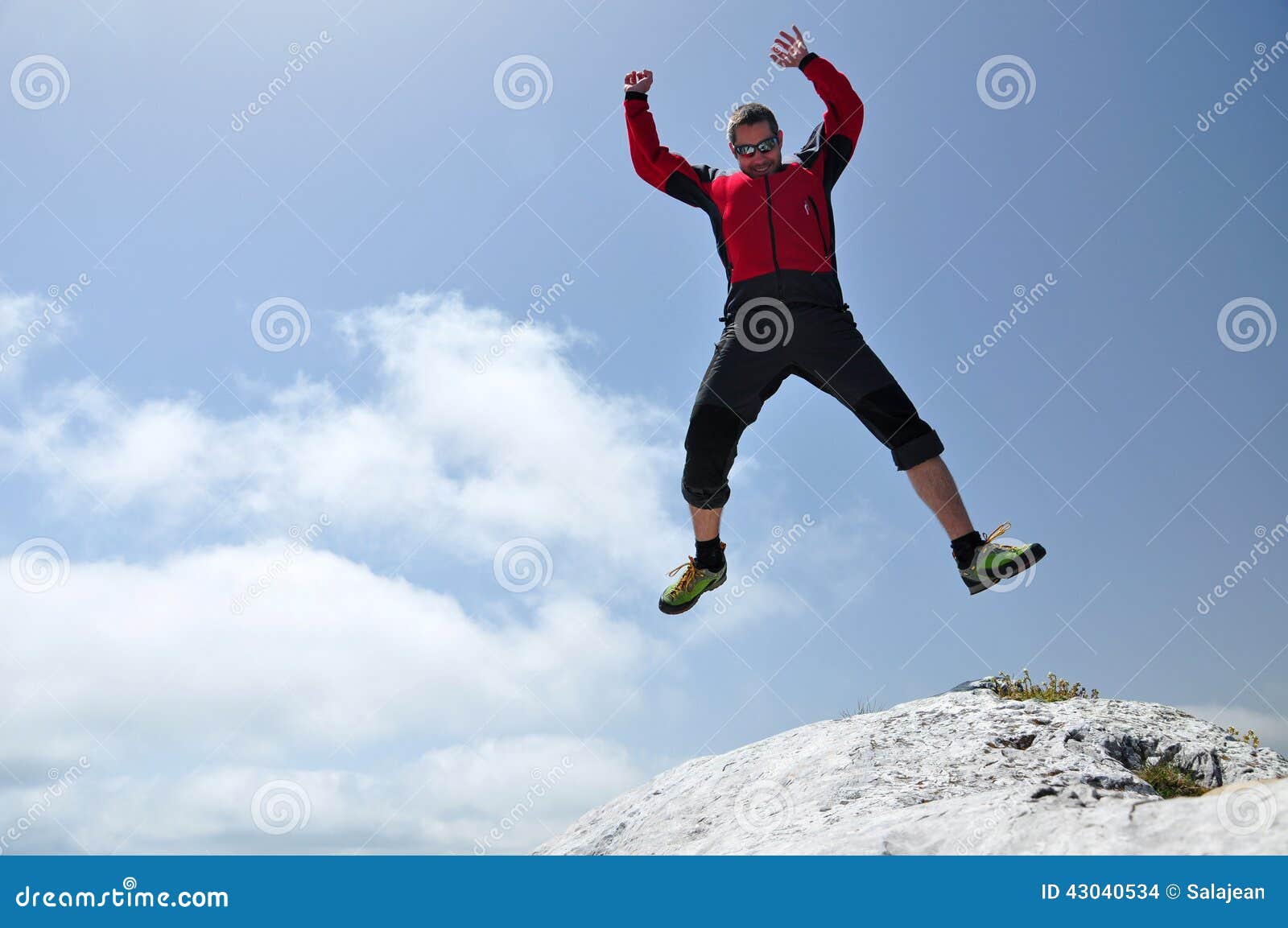 Brave Man Jumping from a Cliff Stock Photo - Image of mountain, jumper ...