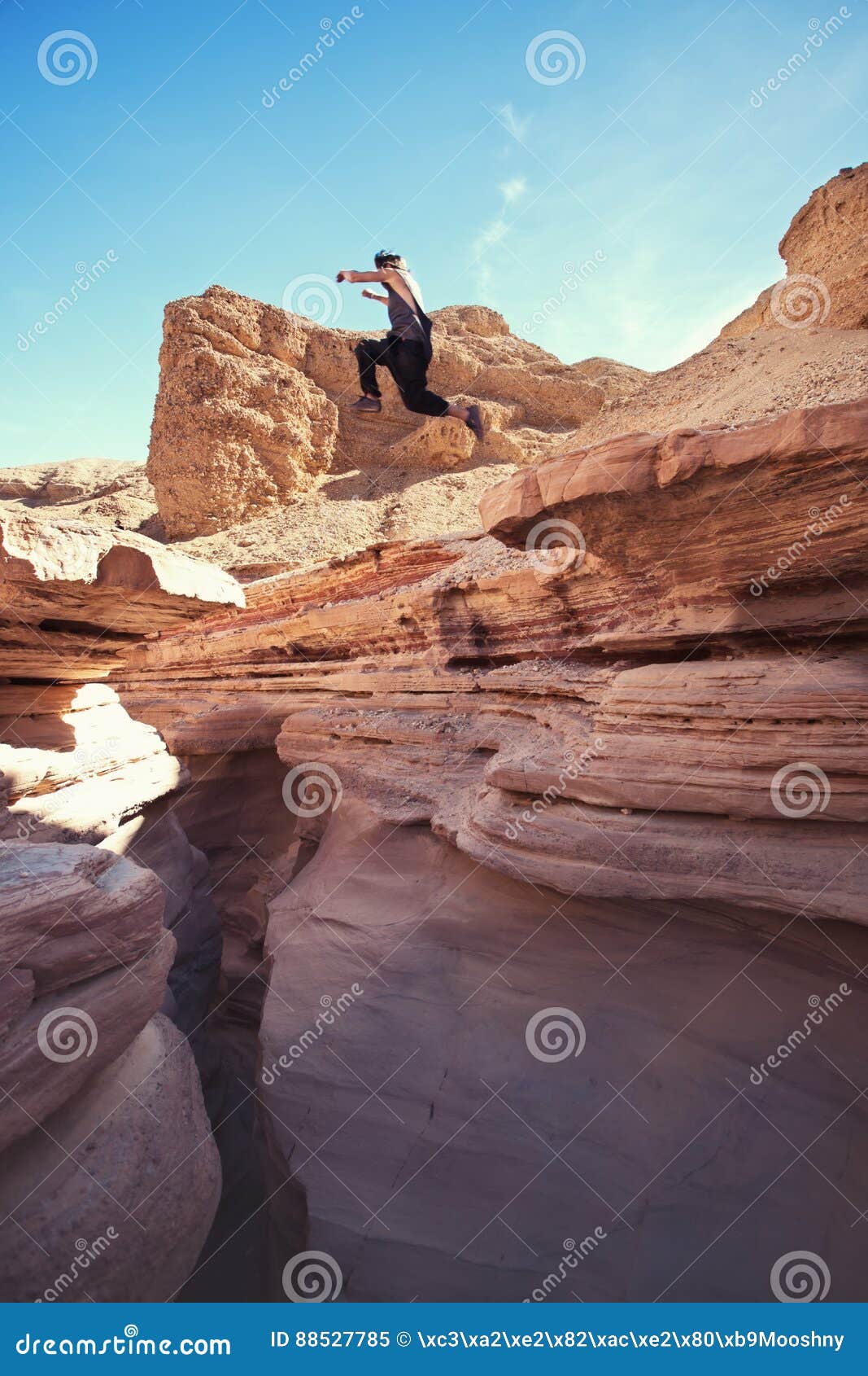 Brave Man Jumping Over the Cliff in Canyon Stock Image - Image of brave ...