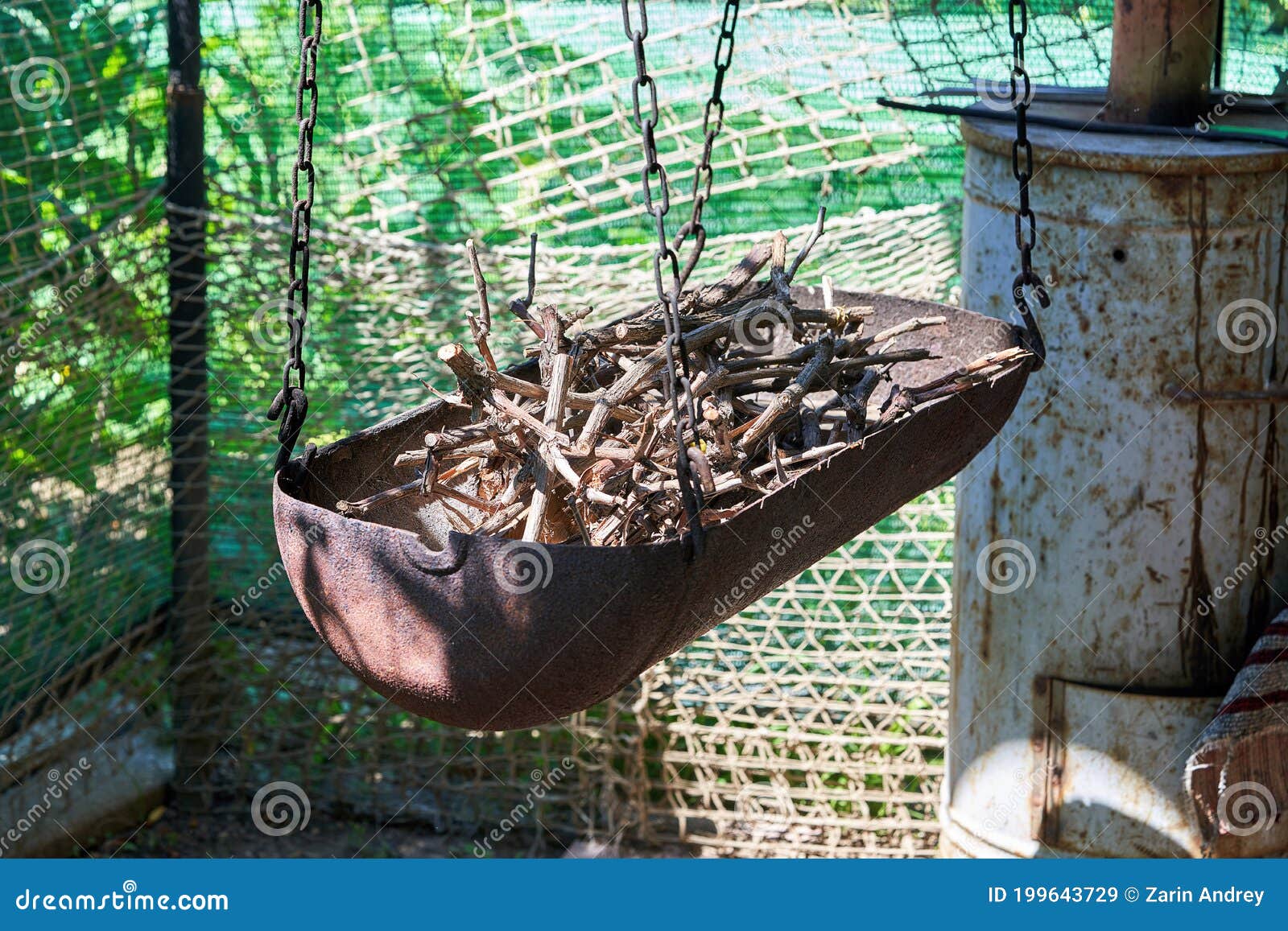 Brazier Hanging on Chains Filled with Wooden Branches Stock Image ...