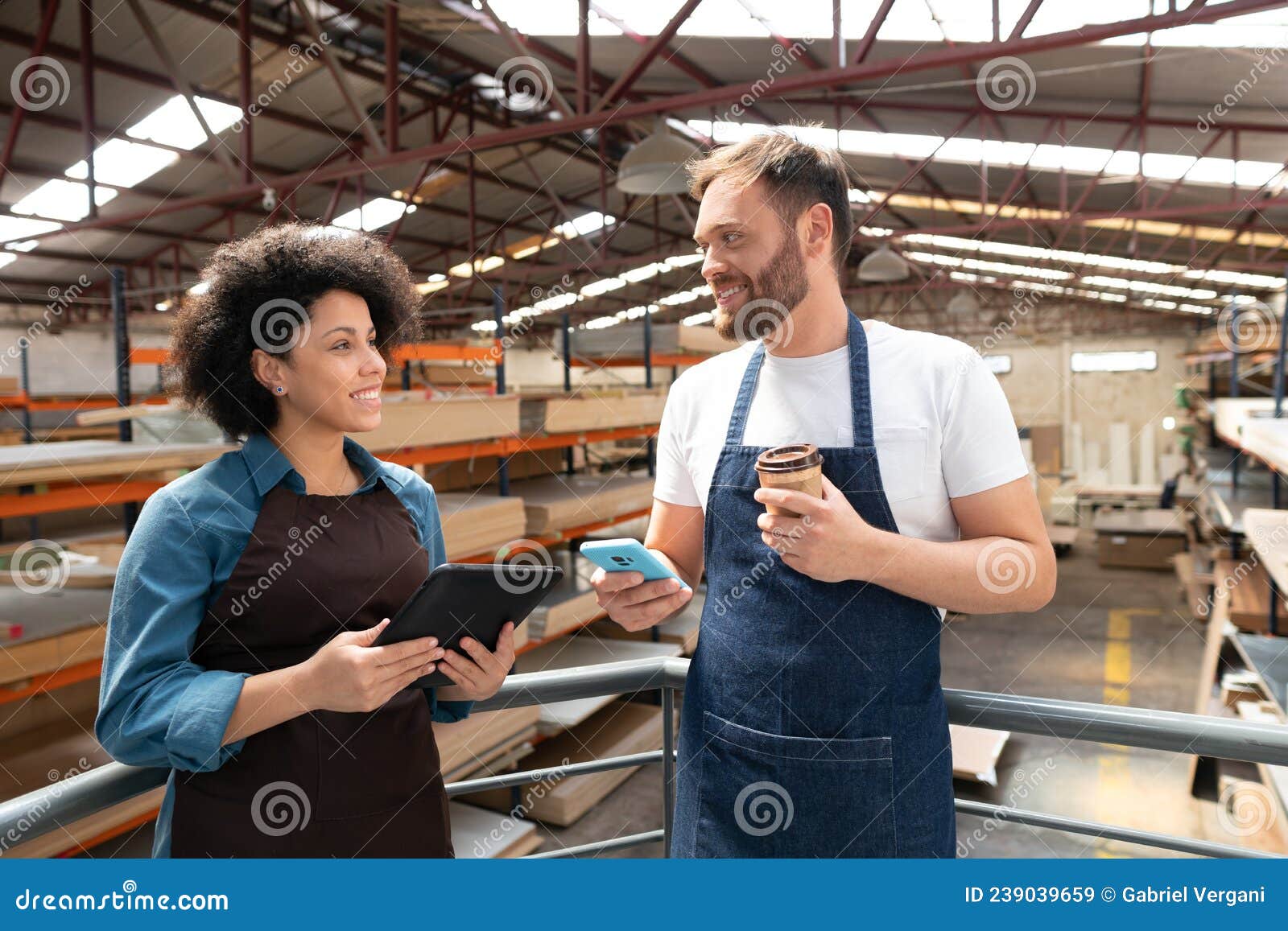 Colleagues Smiling and Looking at Each Other at Warehouse Stock Image ...