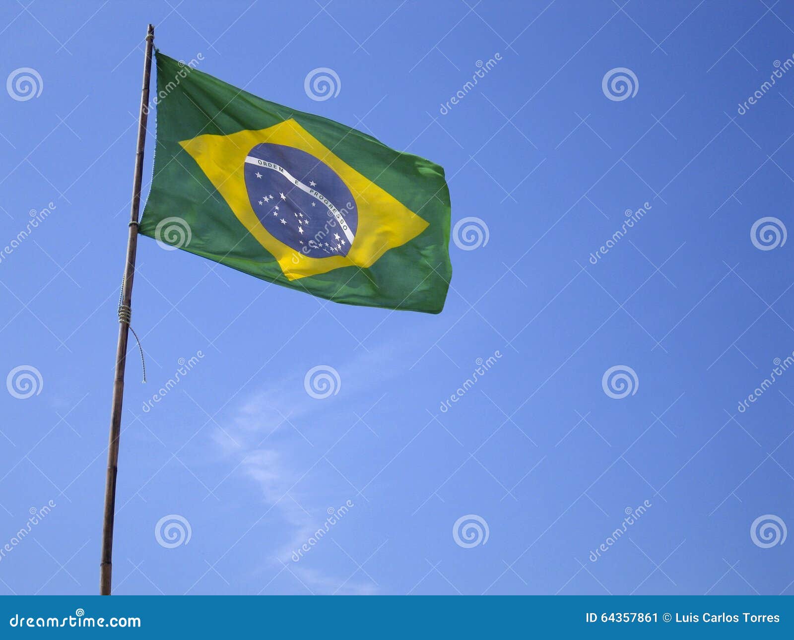 Brazilian flag on blue sky stock image. Image of progress - 64357861