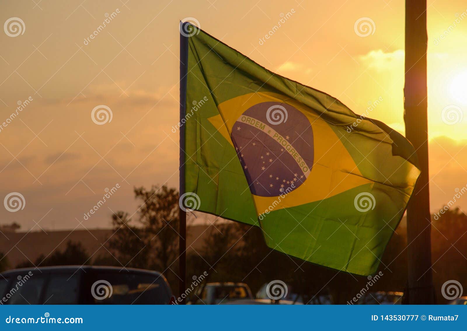 Brazilian flag at sunset stock image. Image of culture - 143530777