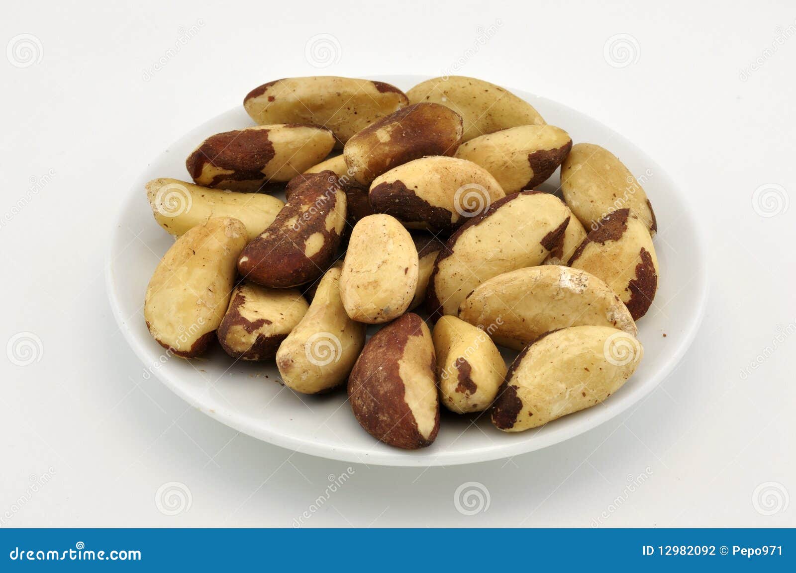 Brazilian nuts on plate stock photo. Image of nutritive - 12982092