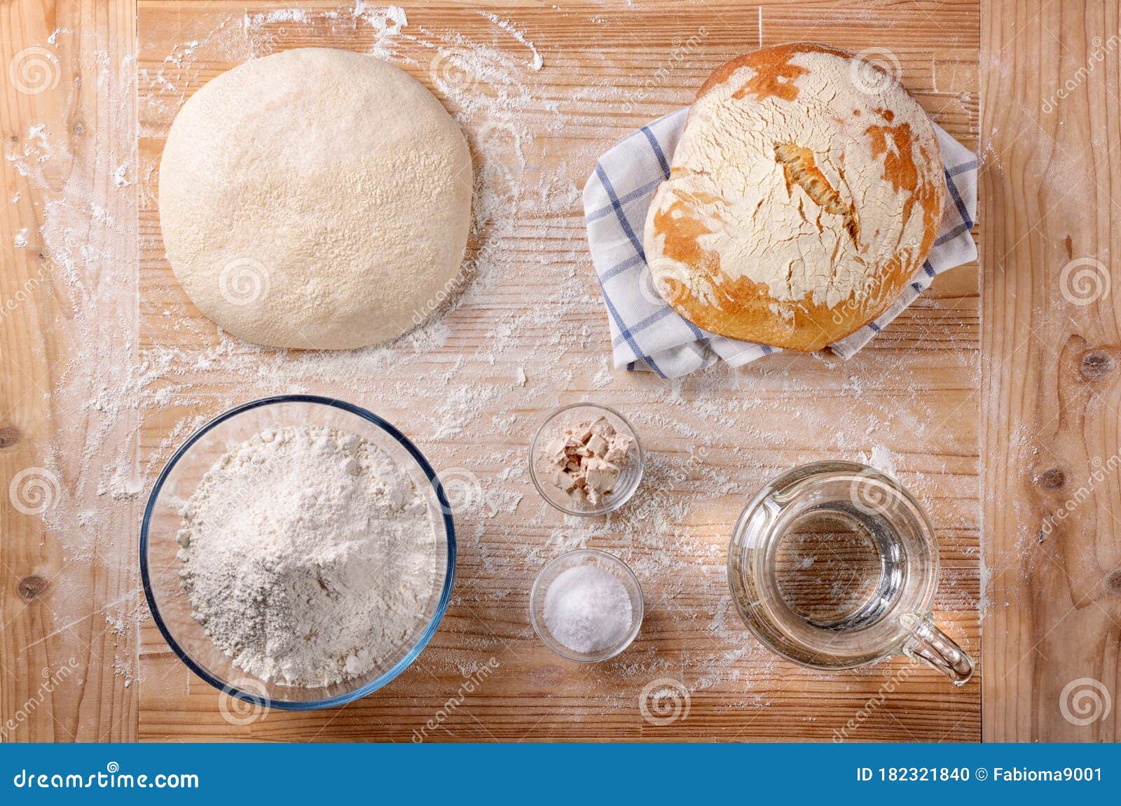 Bread and Basic Ingredients on Pastry Board, Top View. Stock Photo ...