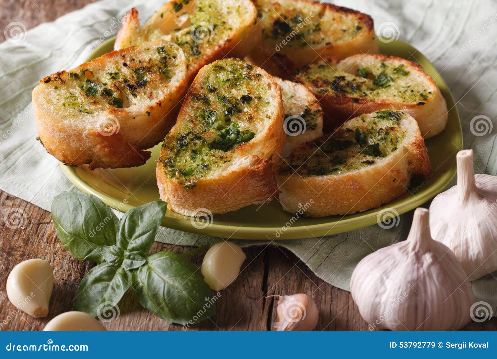 Bread with Basil and Garlic Closeup on Plate. Horizontal Stock Image ...