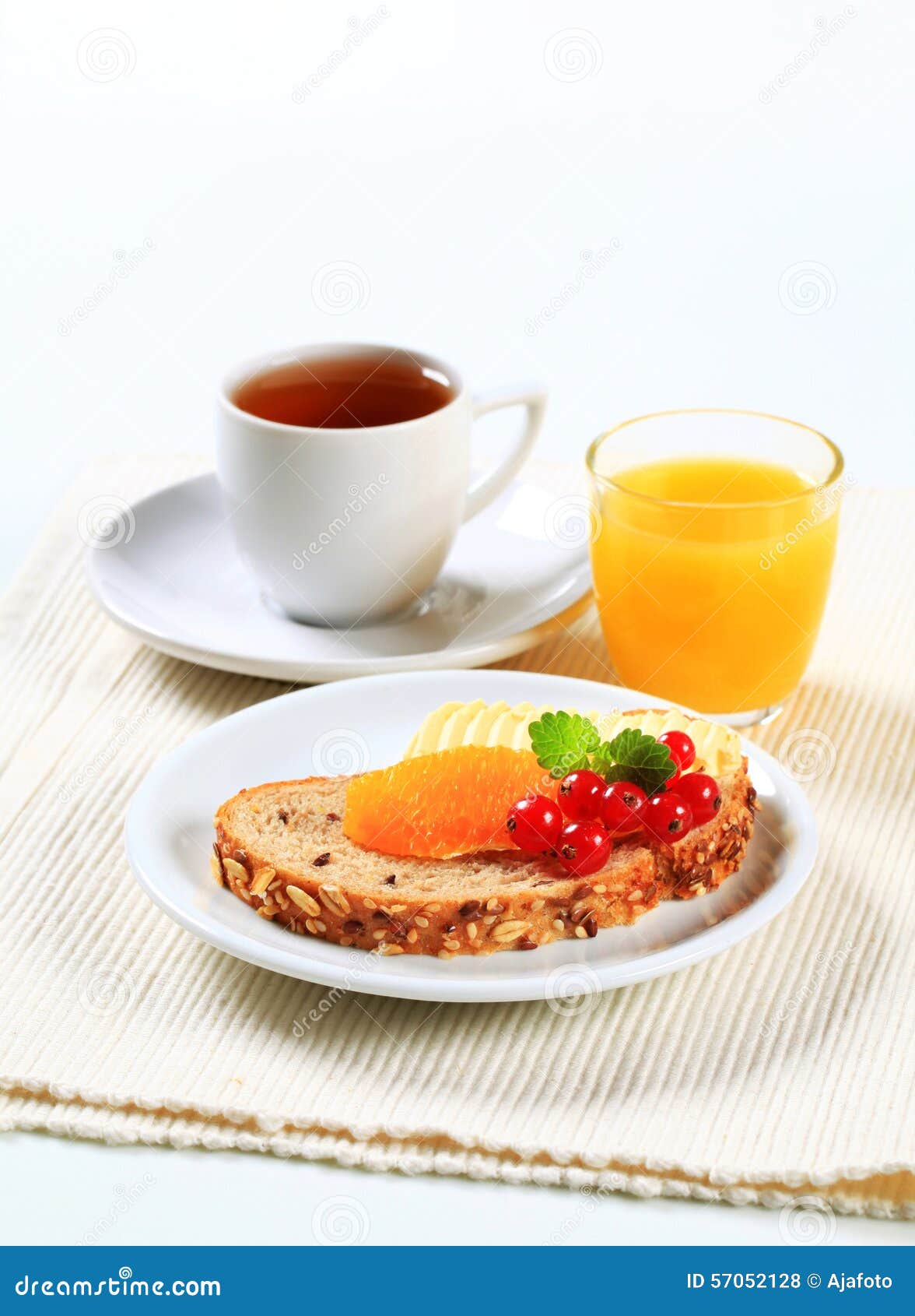 Bread with Butter, Cup of Tea and Orange Juice Stock Photo - Image of ...