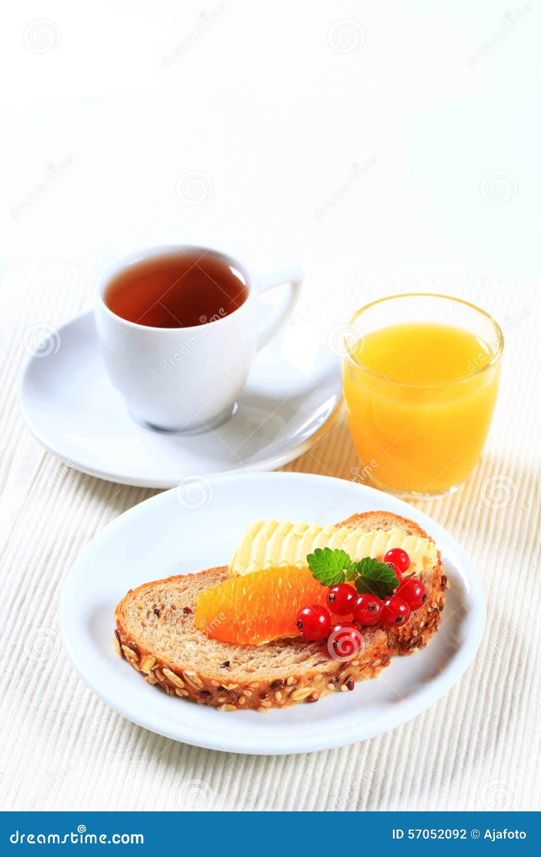 Bread and Butter, Tea and Orange Juice Stock Photo - Image of sesame ...