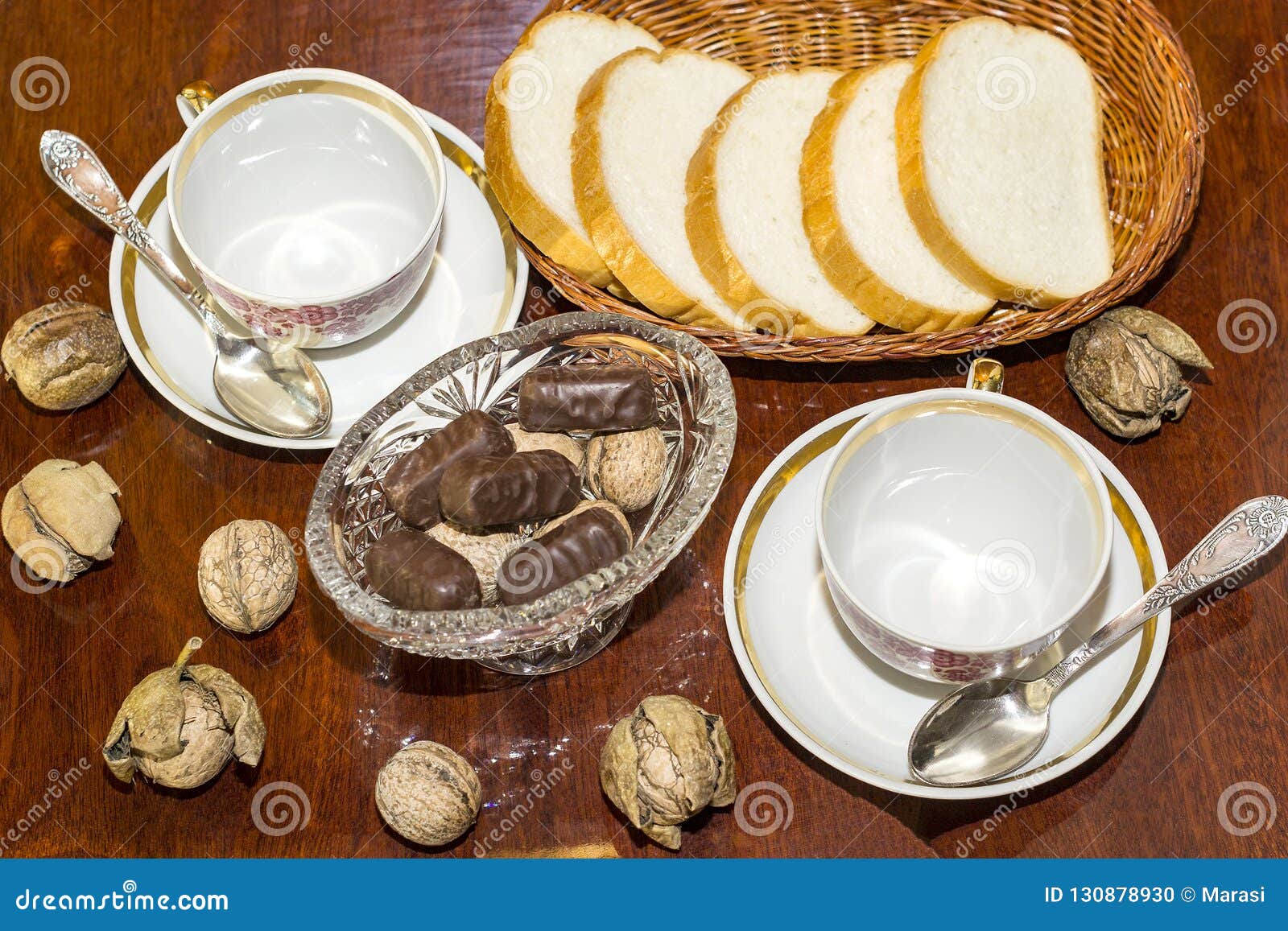 Bread, Chocolates and Two Cups on a Polished Table. Top View Stock ...