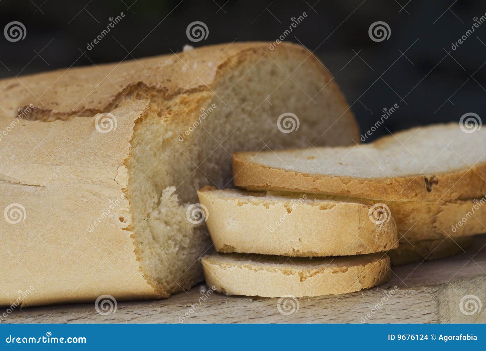 Bread on a chopping board stock photo. Image of board - 9676124