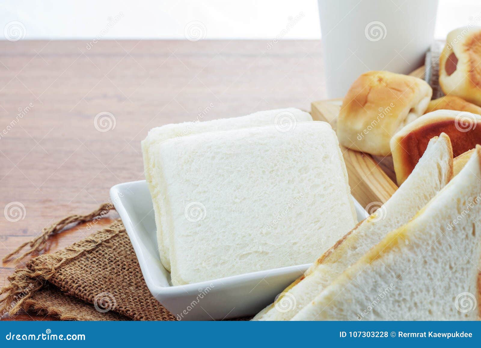 Bread and cup on wooden. stock photo. Image of fresh - 107303228