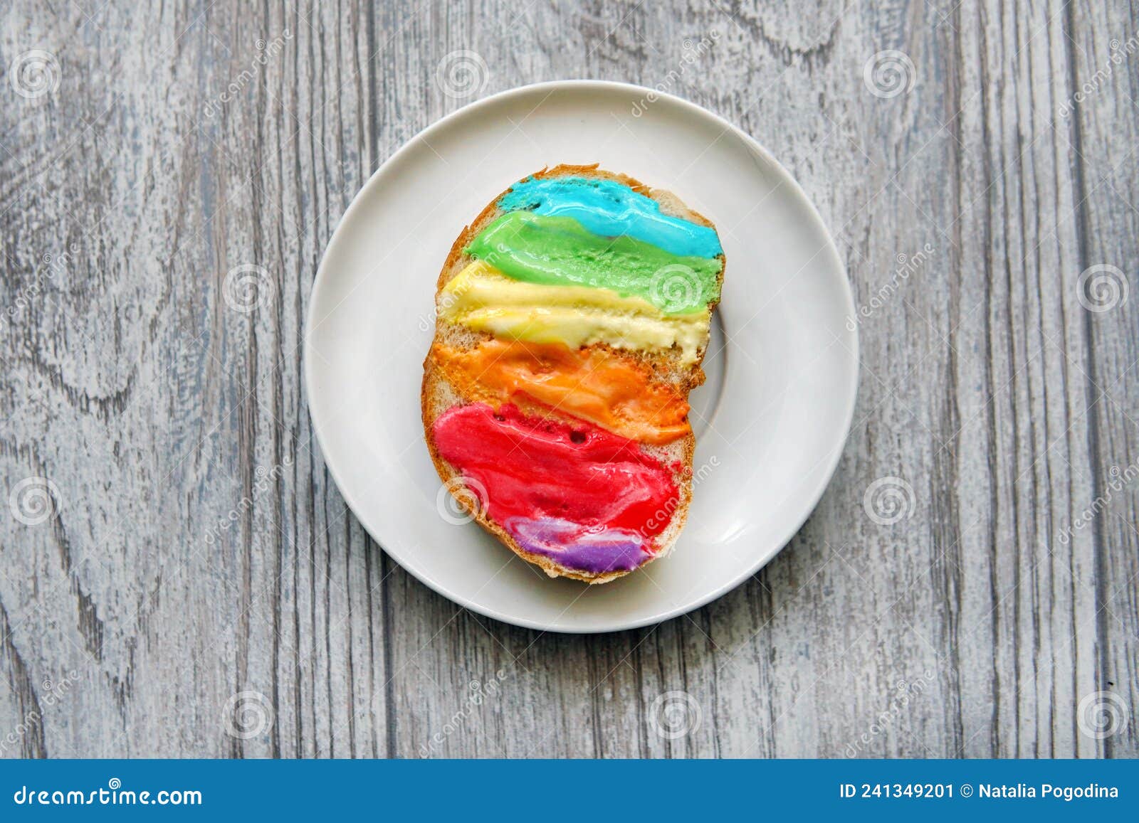The Bread is Colorful Cream. Rainbow on Bread. Breakfast Stock Image ...