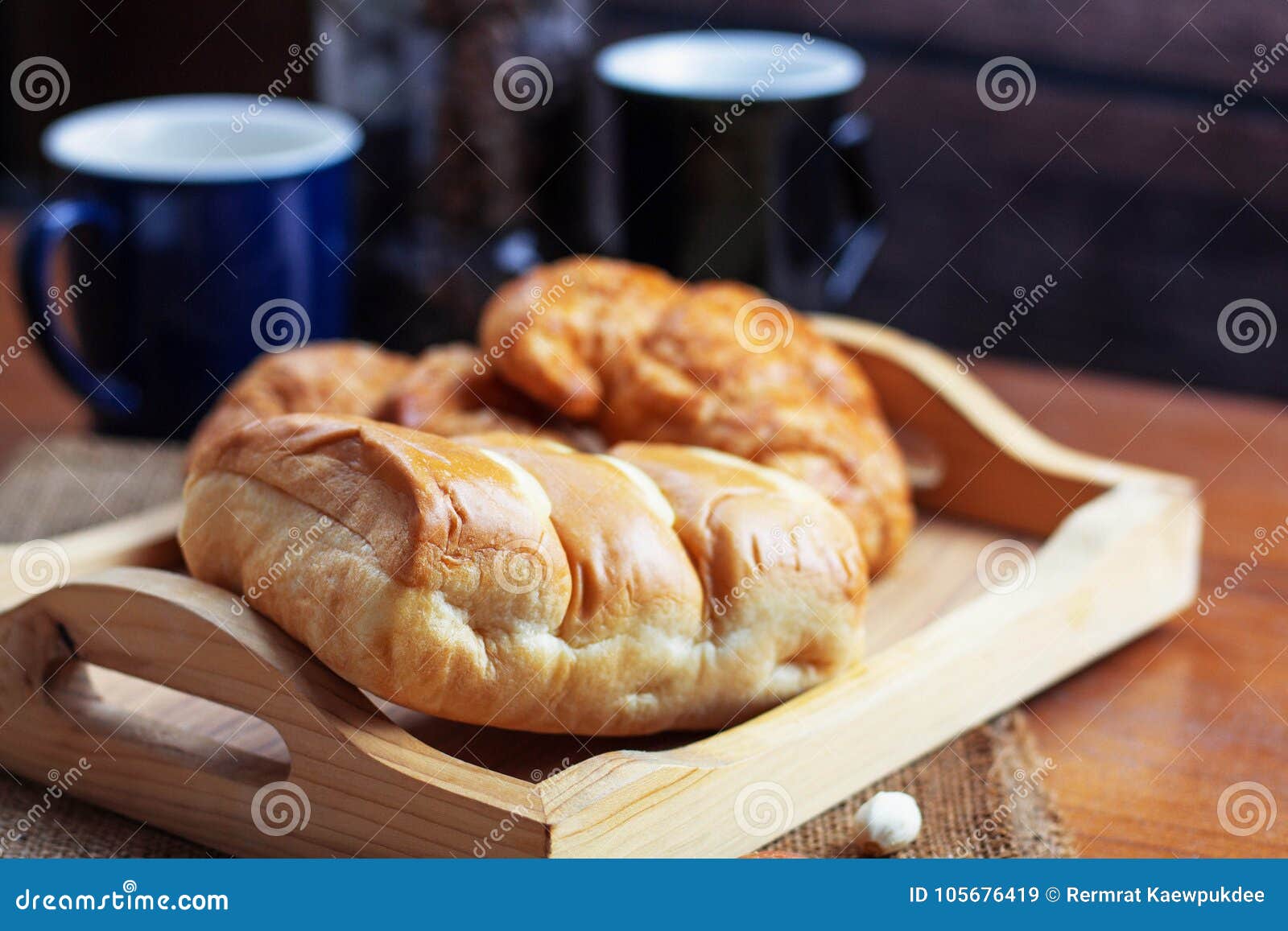 Bread and cup on table. stock image. Image of loaf, moody - 105676419