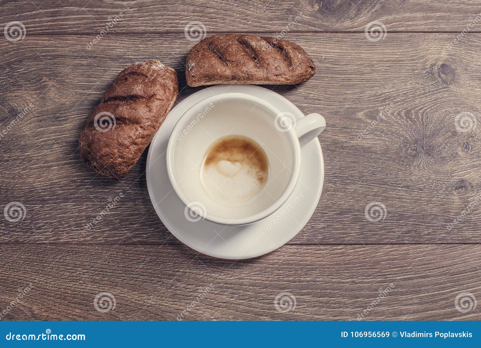 Bread and empy coffee cup. stock image. Image of cappuccino - 106956569
