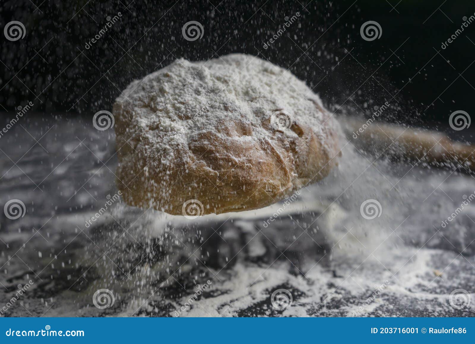 Bread Flying with Flour Splash on Floury Black Table.Creative Concept ...