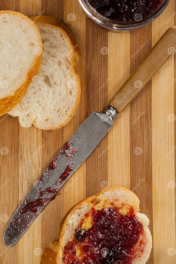 Bread with jam and knife stock image. Image of spread - 84091927