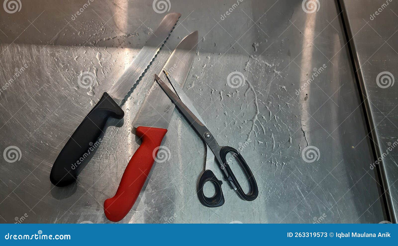 Bread Knife, Scissors and Kitchen Knife on Stainless Table Stock Image ...