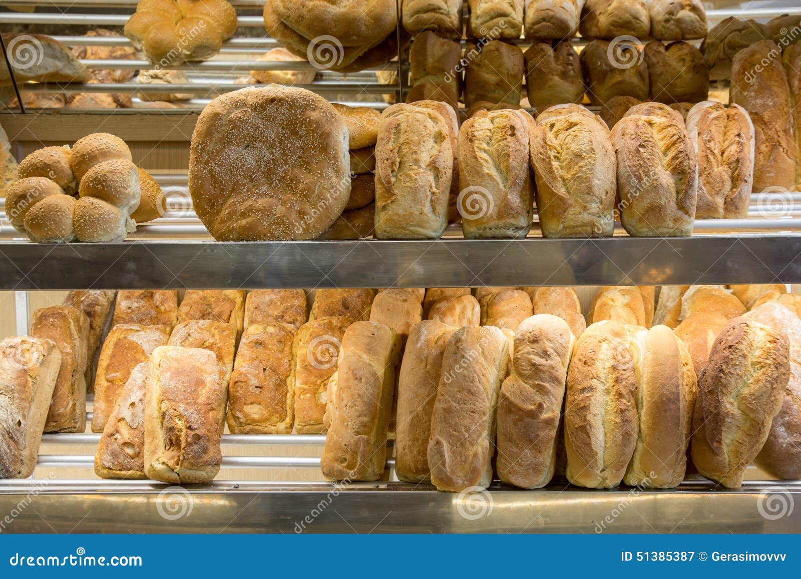 Bread loafs on a shelf stock image. Image of wheat, loaf - 51385387