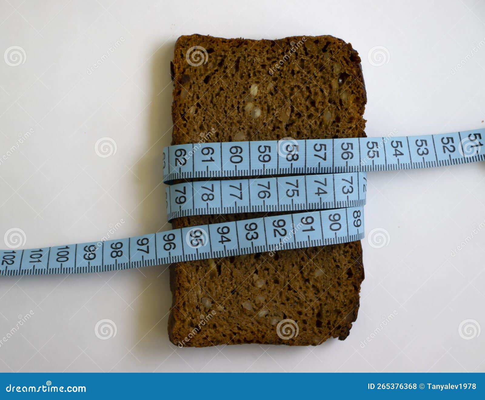 Bread Piece Measuring Tape Portion on Light Background Stock Photo ...