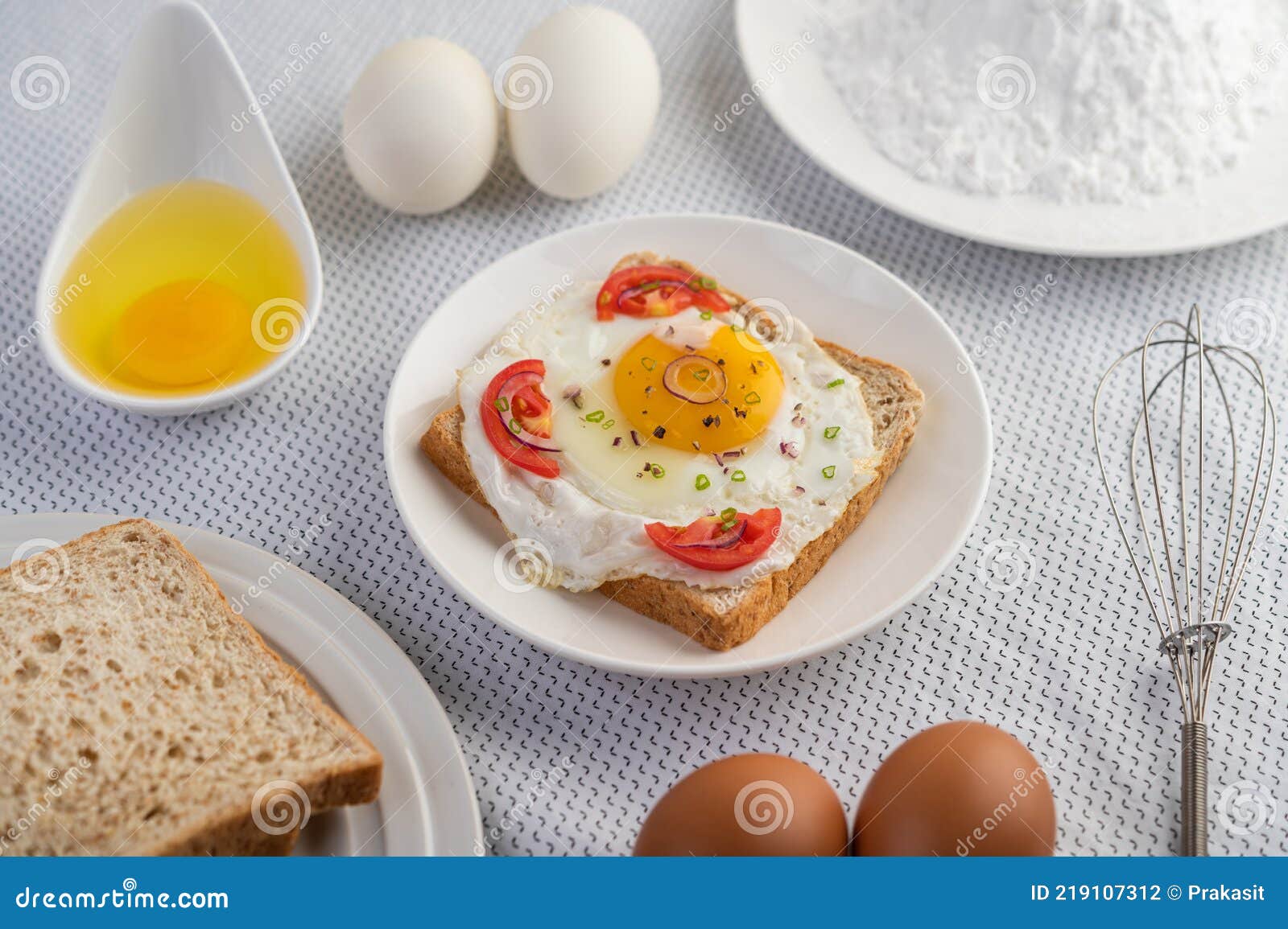 Bread Placed with a Fried Egg with Tomatoes, Tapioca Flour and Sliced â ...
