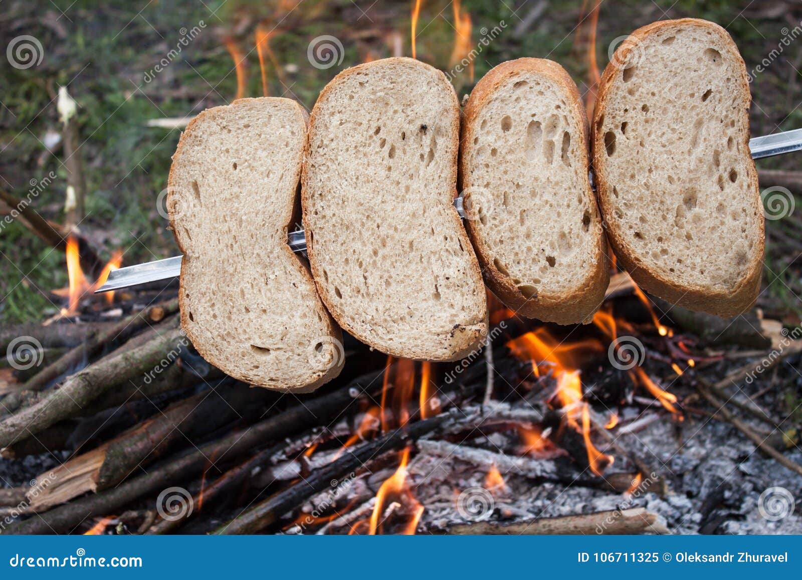 Bread roasting on the fire stock image. Image of closeup - 106711325