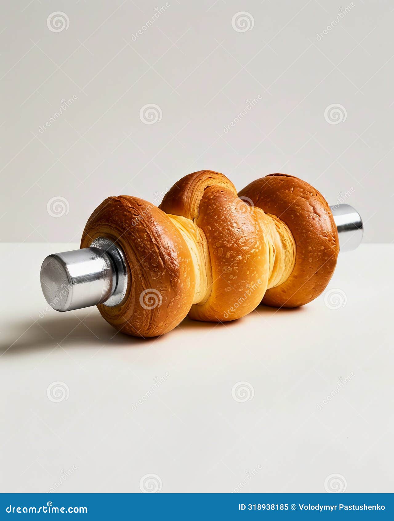 A Bread Roll on a White Surface with Two Handles Stock Image - Image of ...