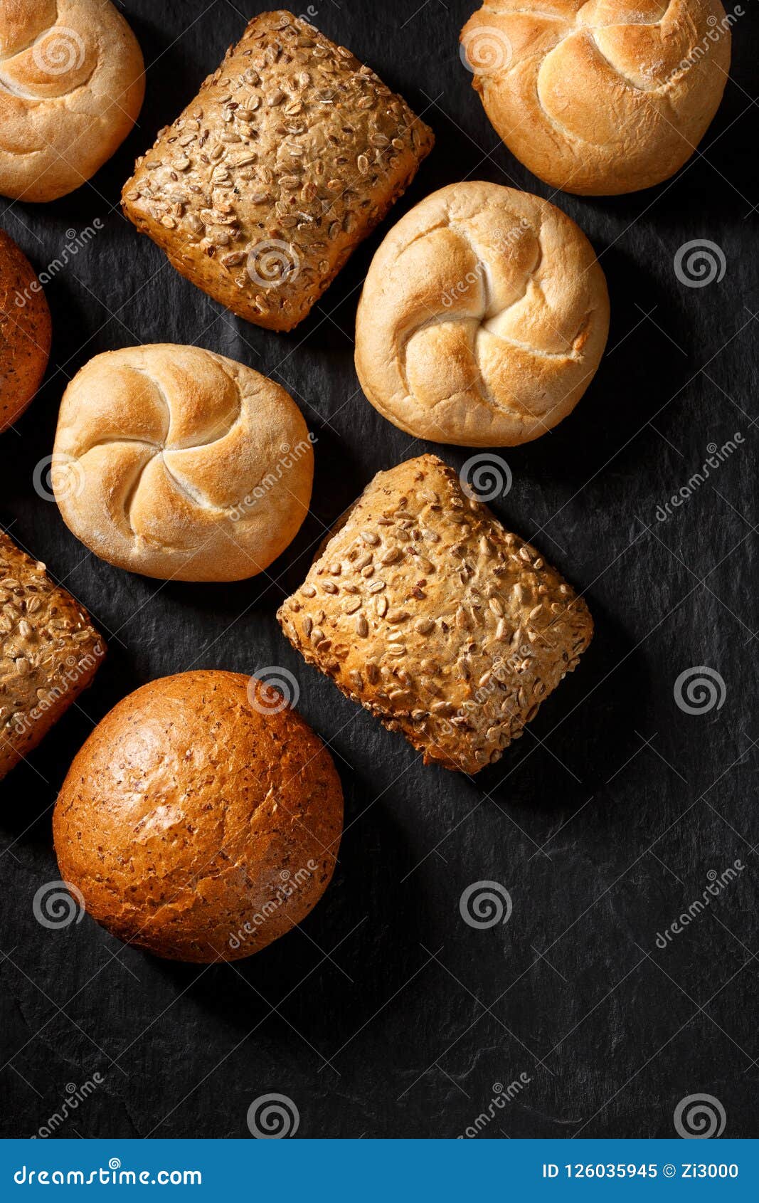 Bread Rolls on a Black Background, Top View Stock Image - Image of ...