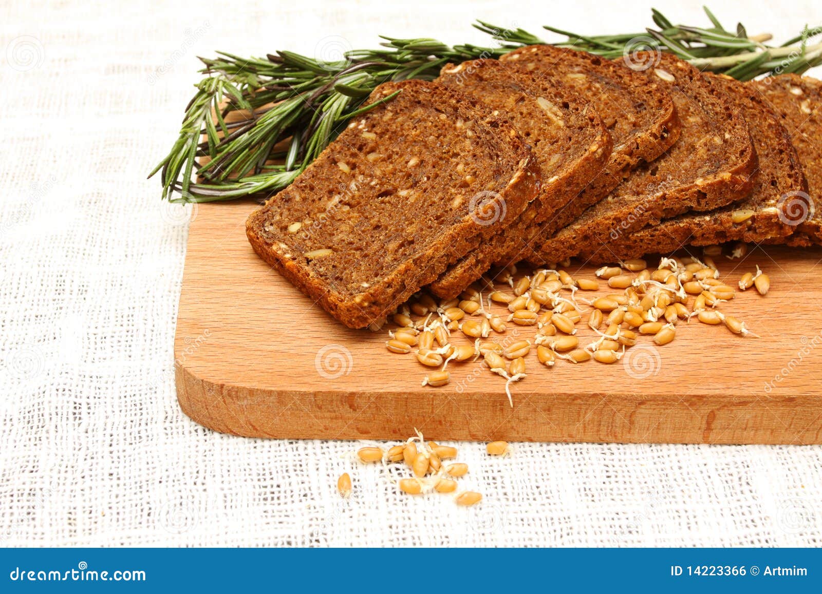 Bread, Rosemary and Wheat Germ on a Wooden Board Stock Photo - Image of ...