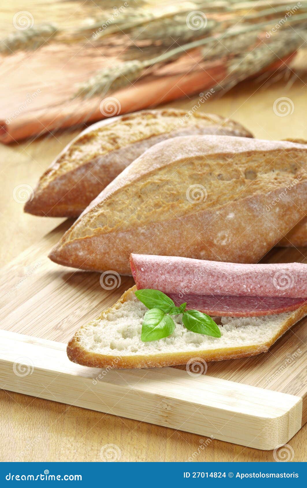 Bread with Salami and Basil Stock Photo - Image of halved, break: 27014824