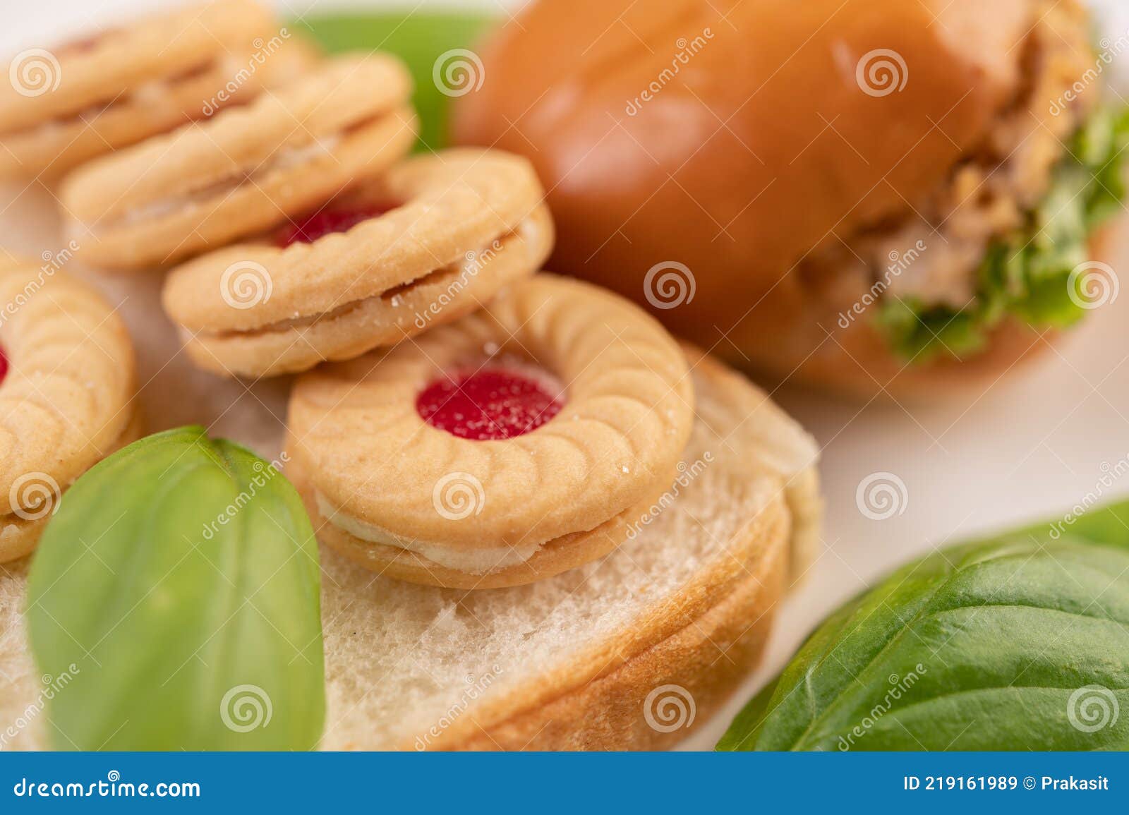 Bread Slices, Stuffed Buns, and Burgers on a White Plate Stock Image ...