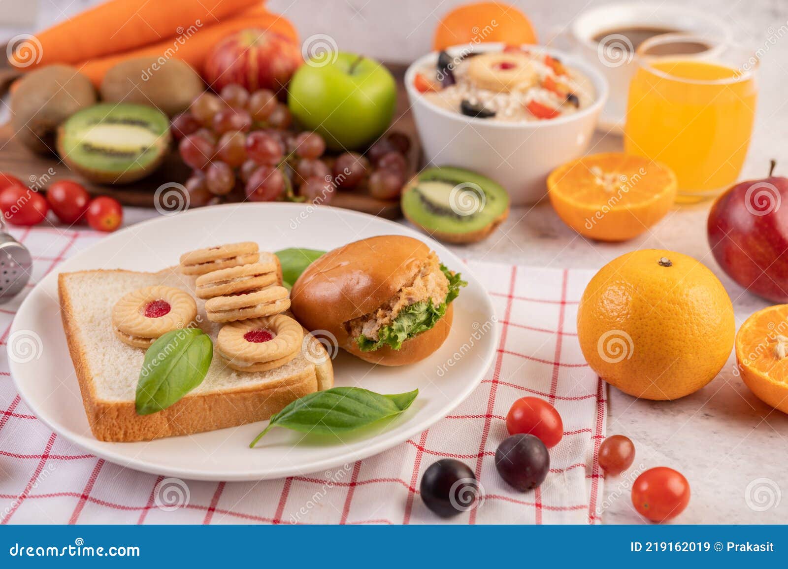 Bread Slices, Stuffed Buns, and Burgers on a White Plate Stock Image ...