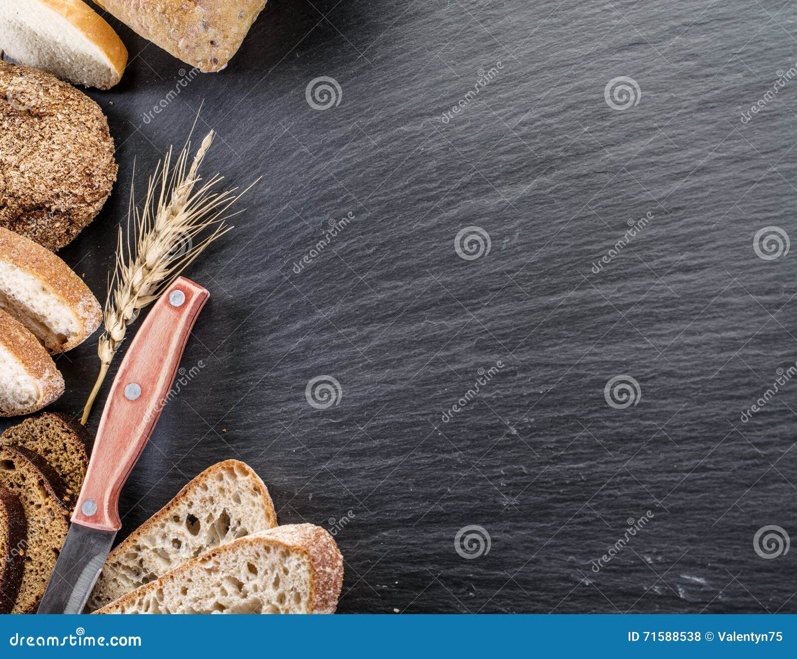 Bread Slices, a Wheat and a Knife on the Black Stone. Stock Photo ...