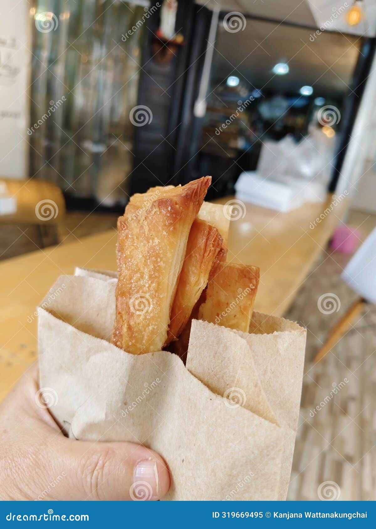 Bread Sticks in Paper Bag in Hand. Stock Image - Image of food, dessert ...