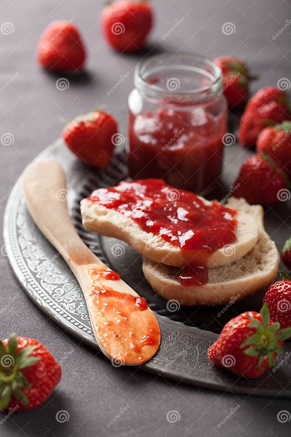 Bread with strawberry jam stock image. Image of plate - 26843443