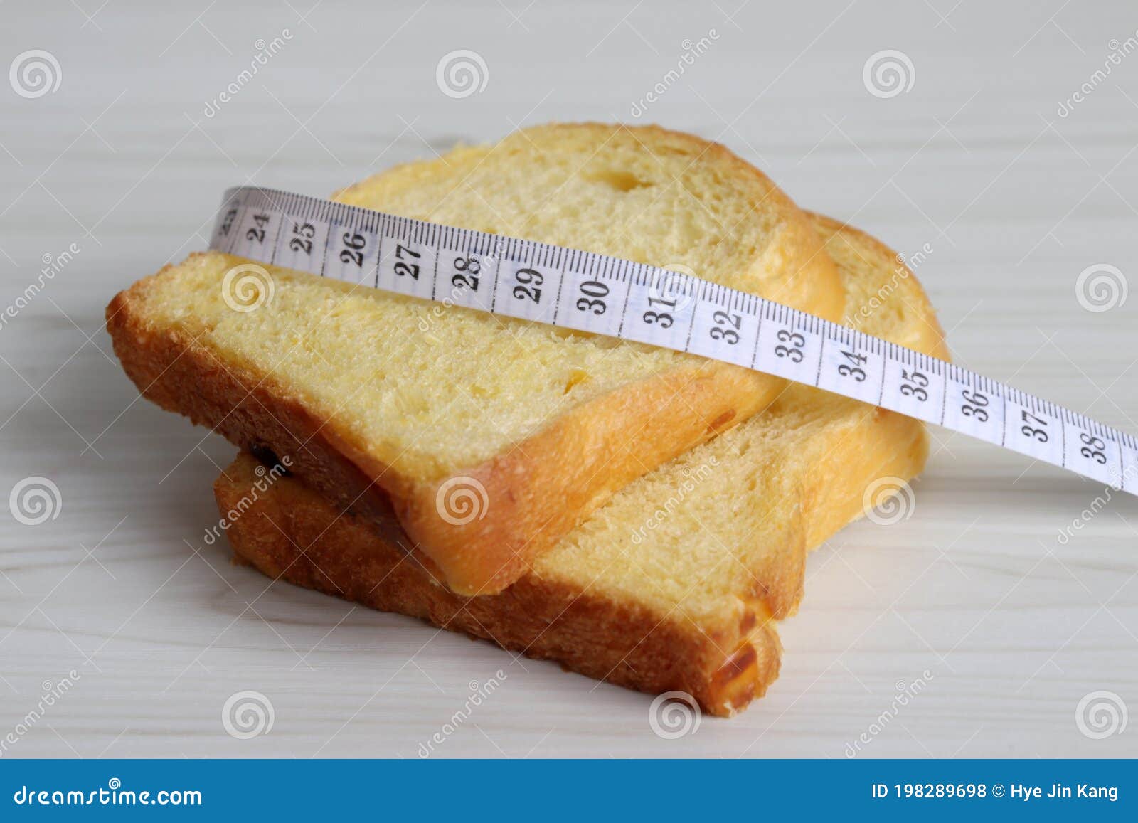 Bread and a tape measure. stock photo. Image of diet - 198289698