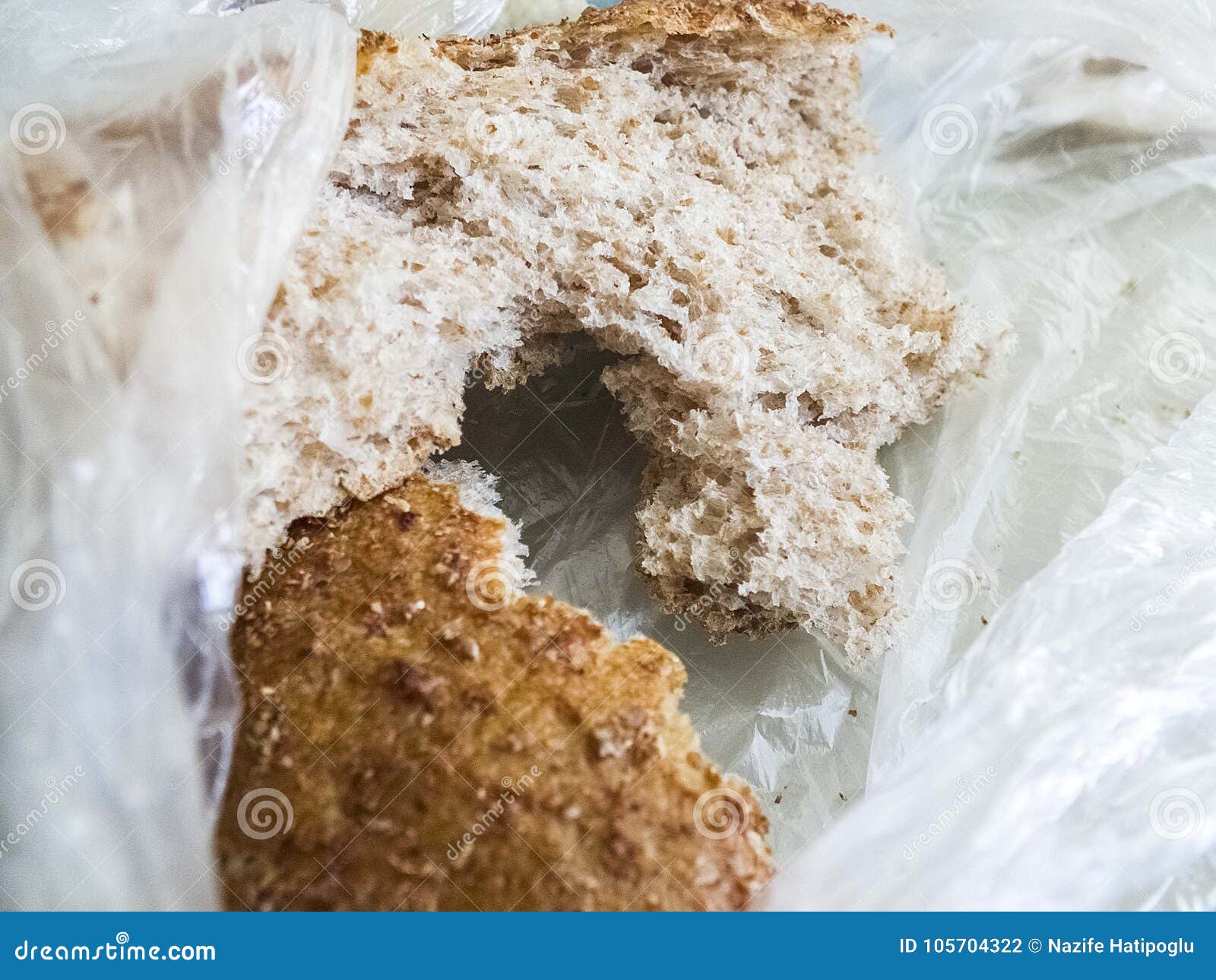 Bread Thrown in the Trash, Waste of Bread, Stale Piece of Bread, Stock ...