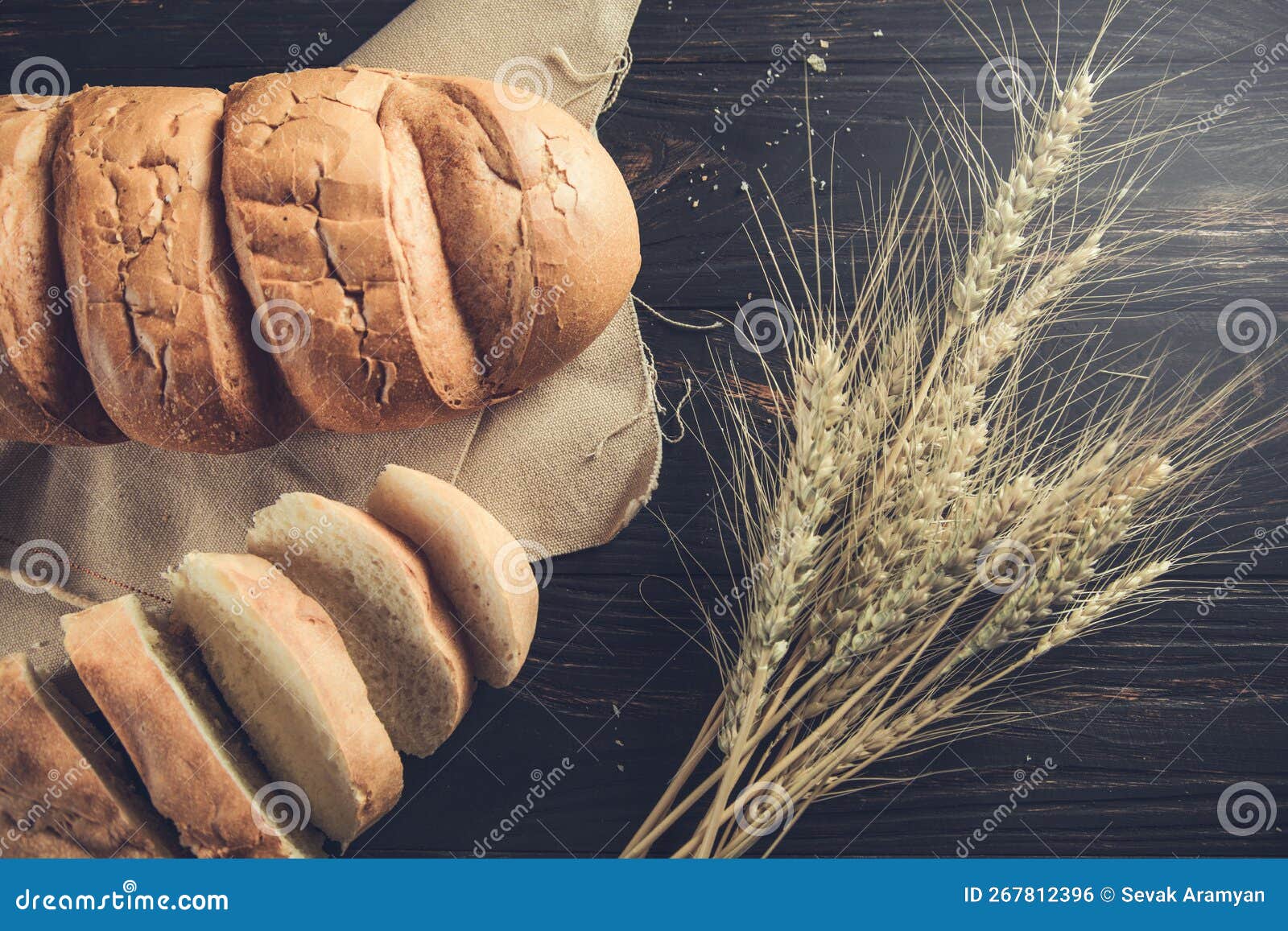 Bread and Wheat on the Table Stock Photo - Image of brown, gourmet ...