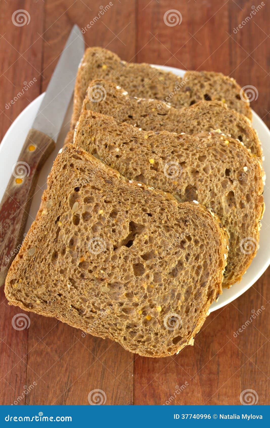 Bread on white plate stock photo. Image of natural, baked - 37740996