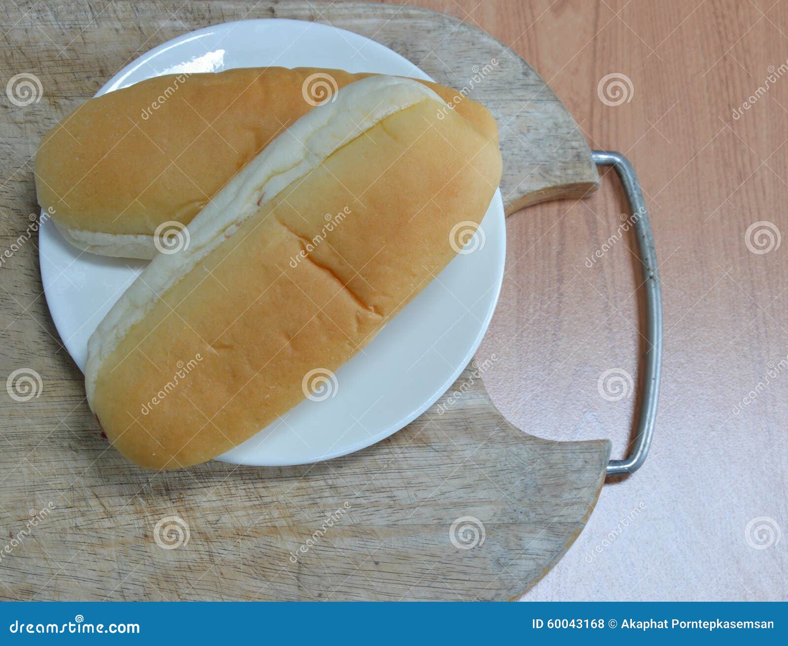 Bread on wooden chop block stock photo. Image of object - 60043168