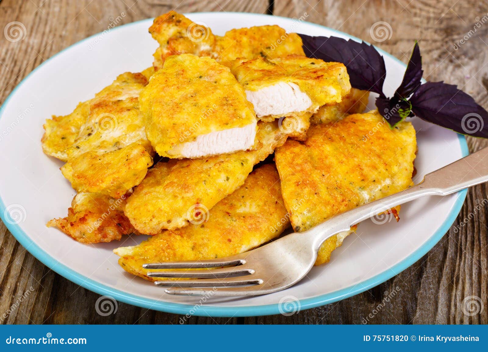 Breaded Chicken Fillet with Herbs Stock Photo - Image of crockery ...