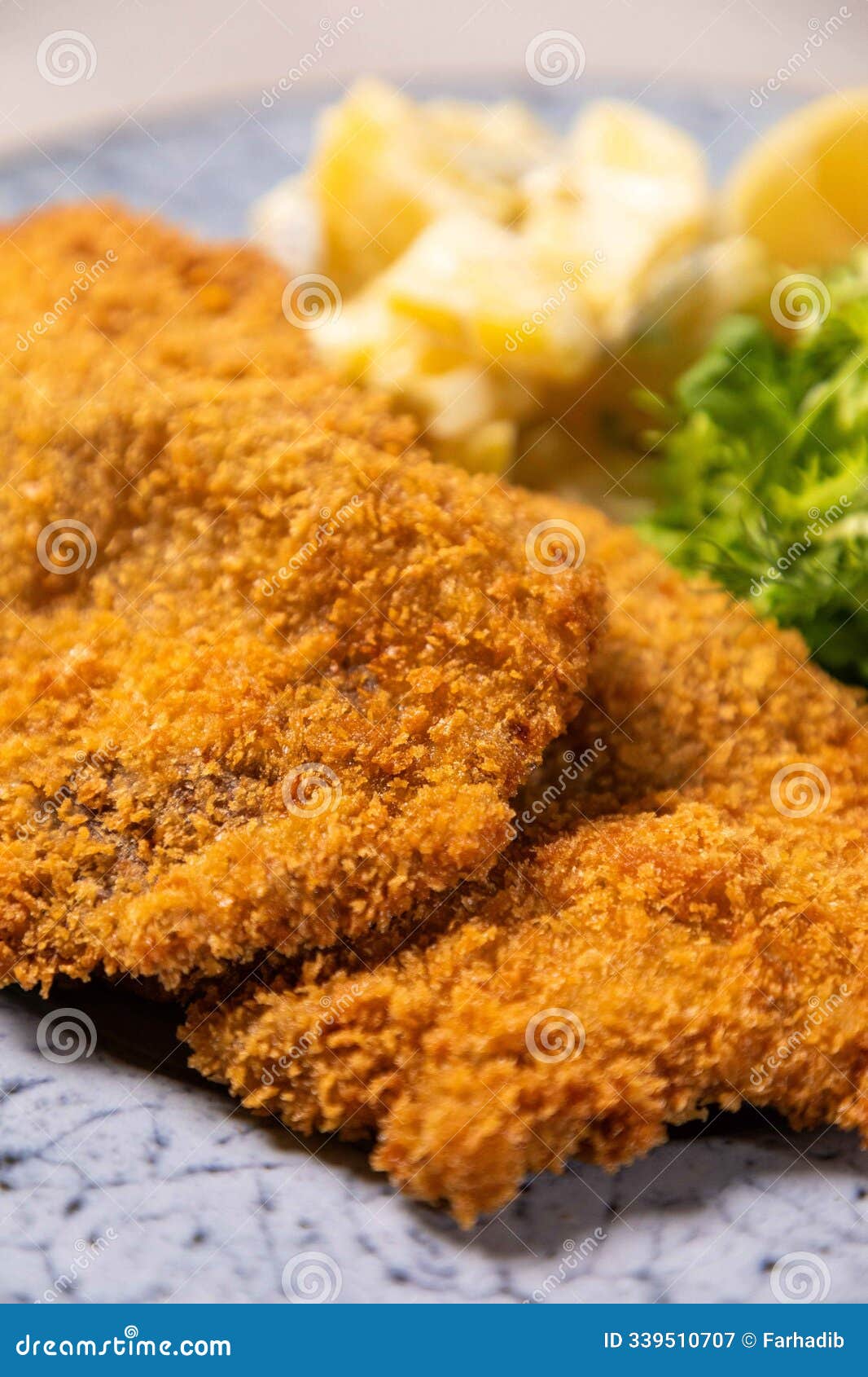 Breaded Chicken Escalope Or Chicken Schnitzel With Potatoes And Green ...