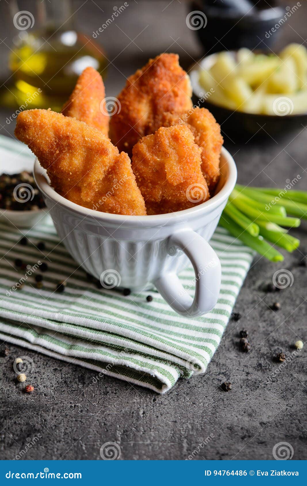 Breaded Mini Chicken Fillets with Potato Stock Photo - Image of chicken ...