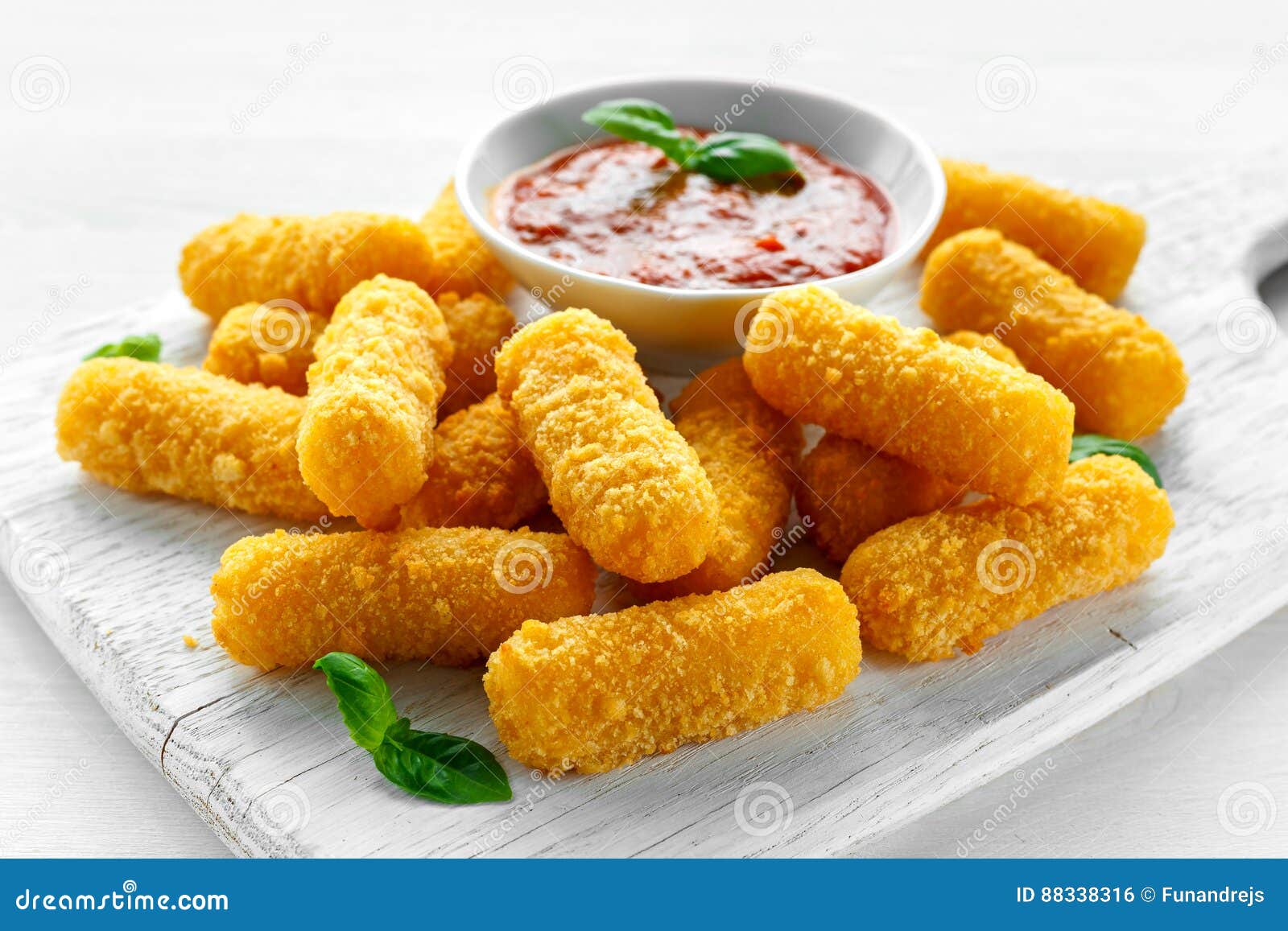 Breaded Mozzarella Cheese Sticks with Tomato Basil Sauce Stock Photo ...